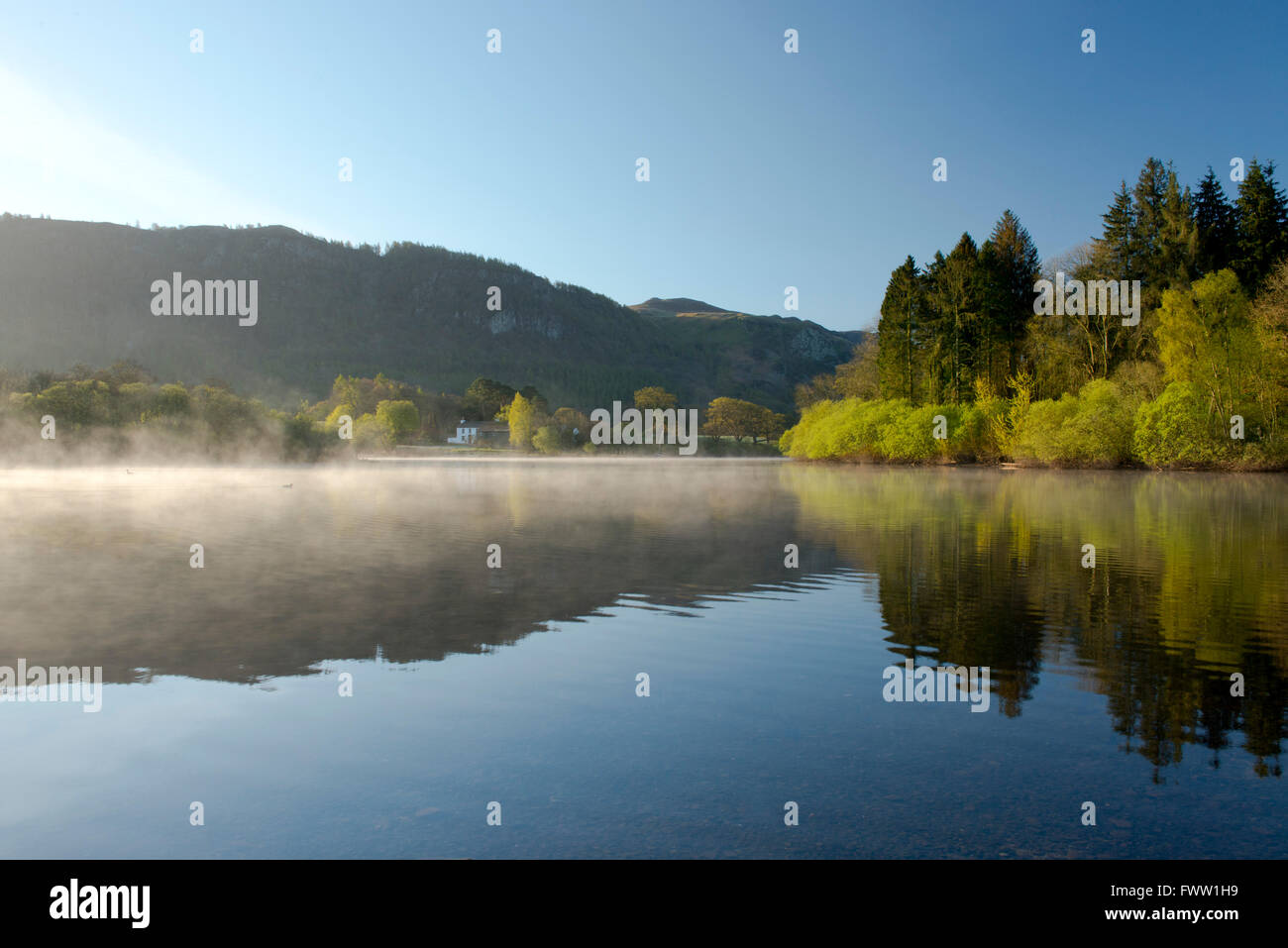 Early morning mist on Derwent Water, in the Lake District National Park ...