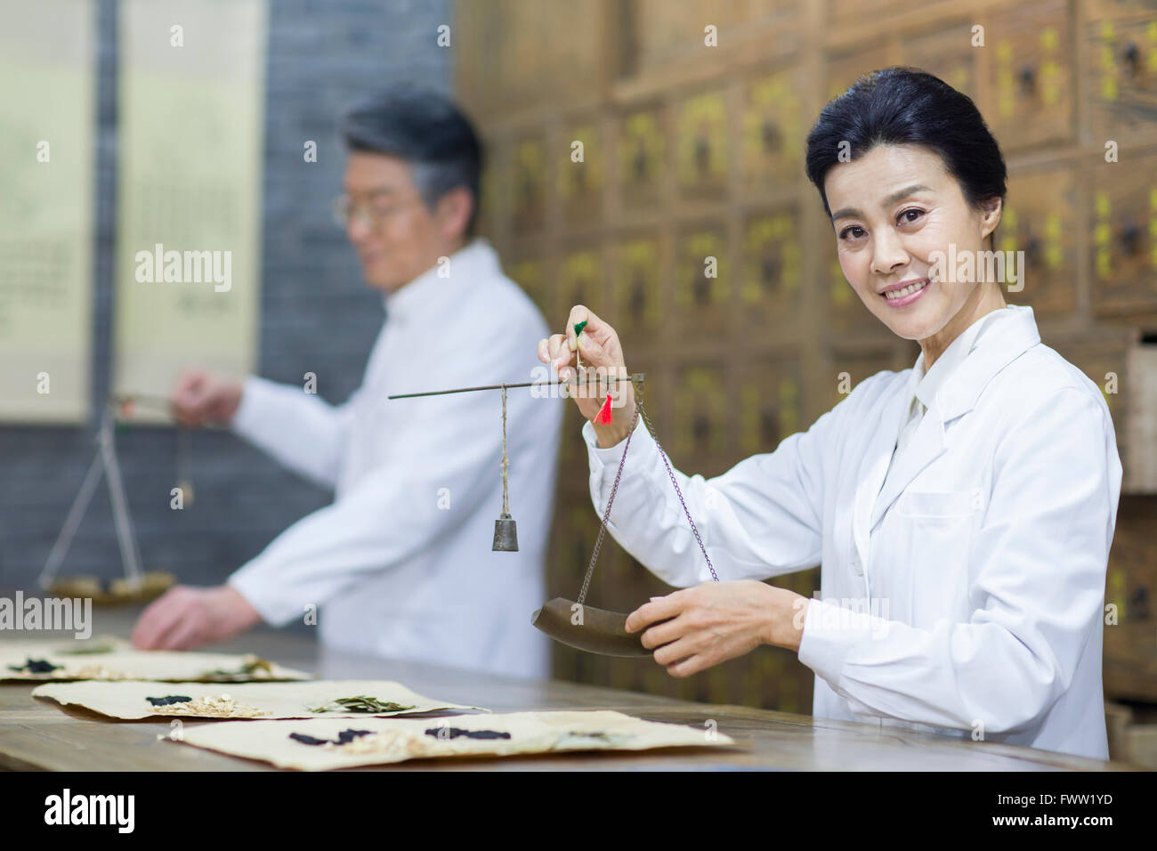 Chinese doctors fill the prescription Stock Photo - Alamy