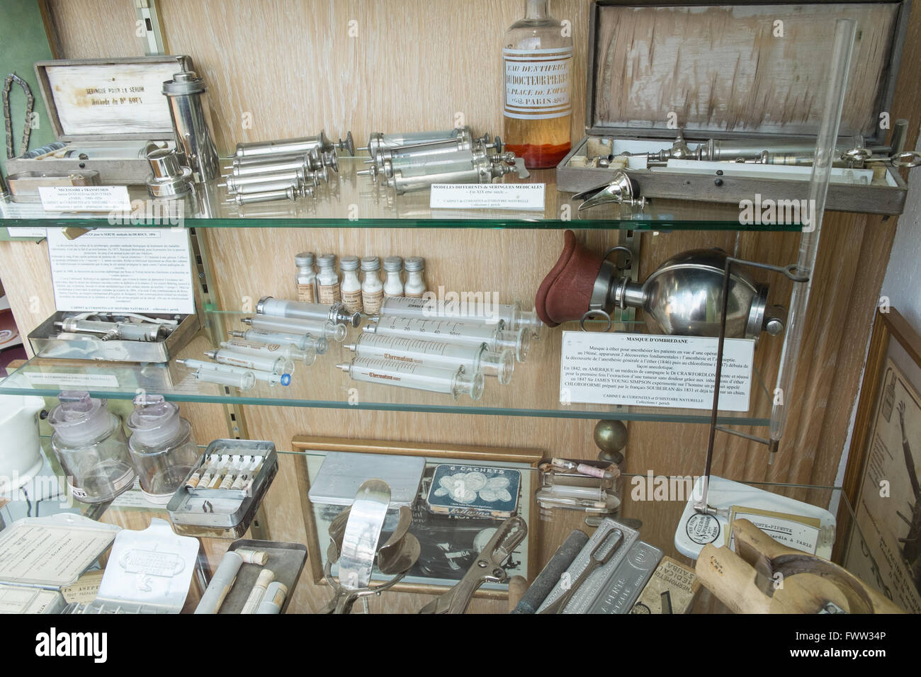 Antique surgical instruments,tools on display in window at pharmacy in ...