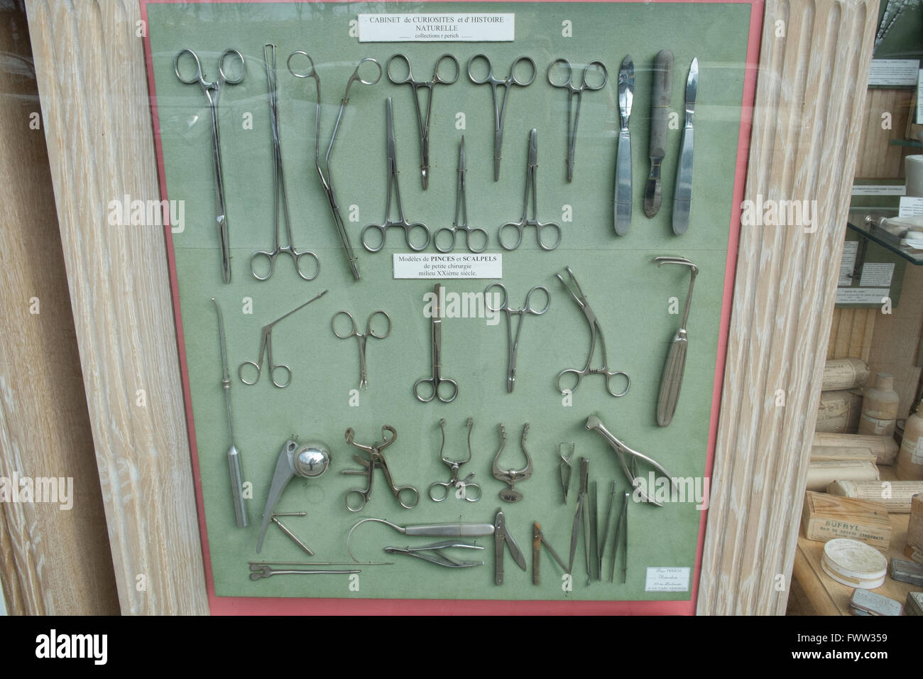 Antique surgical instruments,tools on display in window at pharmacy in ...