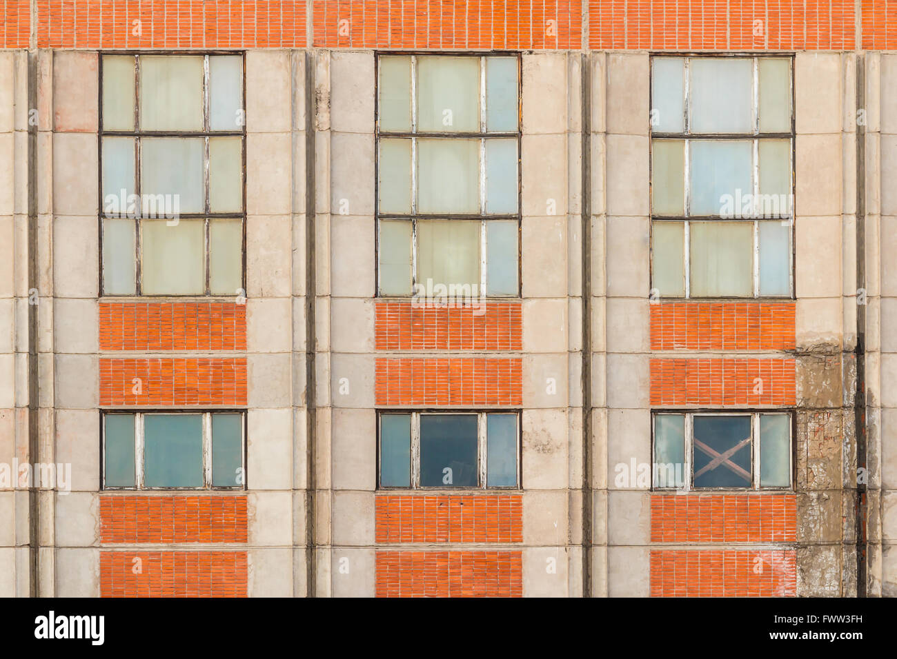Several windows in row on facade of industrial building front view, St ...