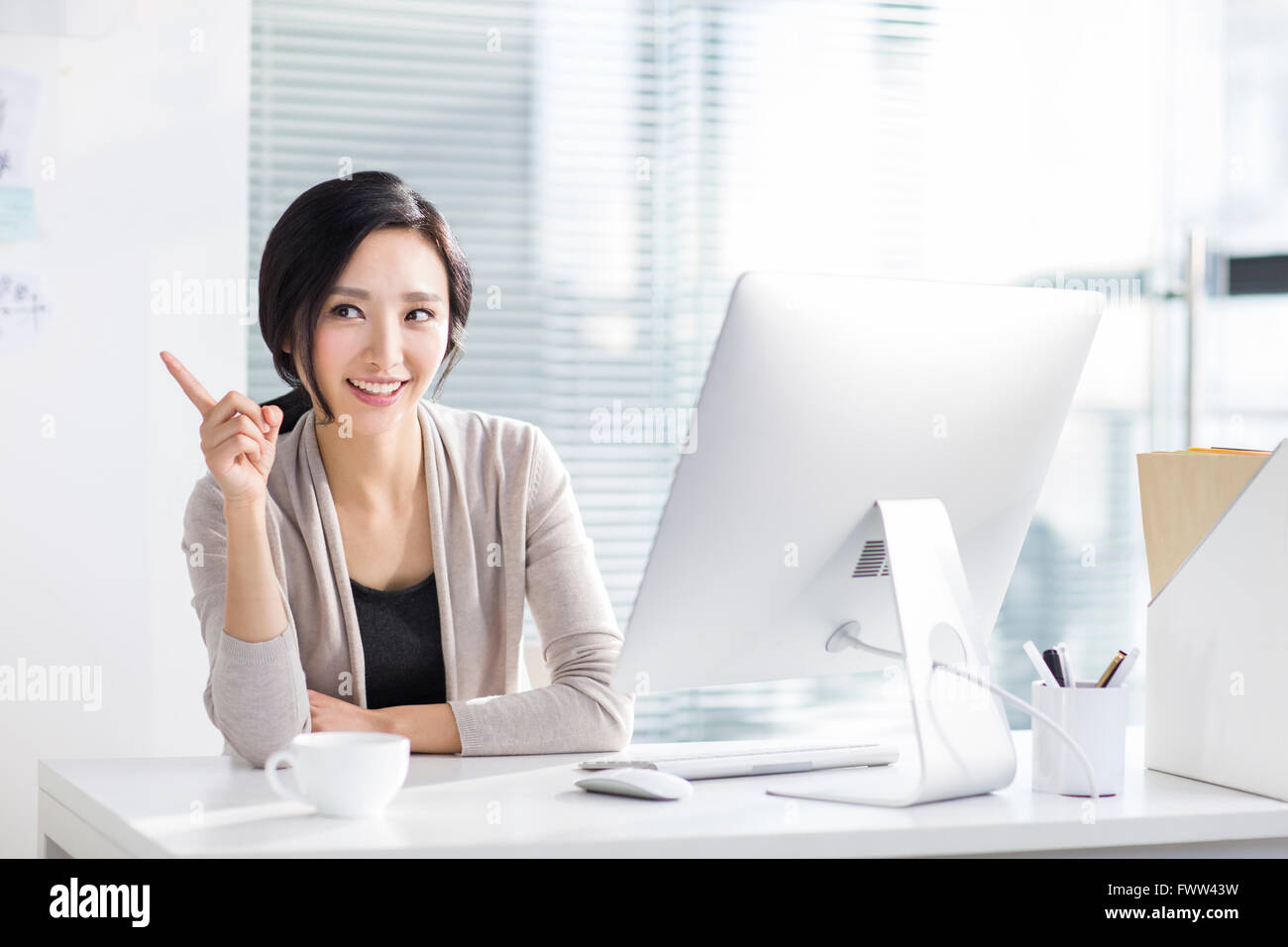 Woman thinking having idea pointing hi-res stock photography and images ...