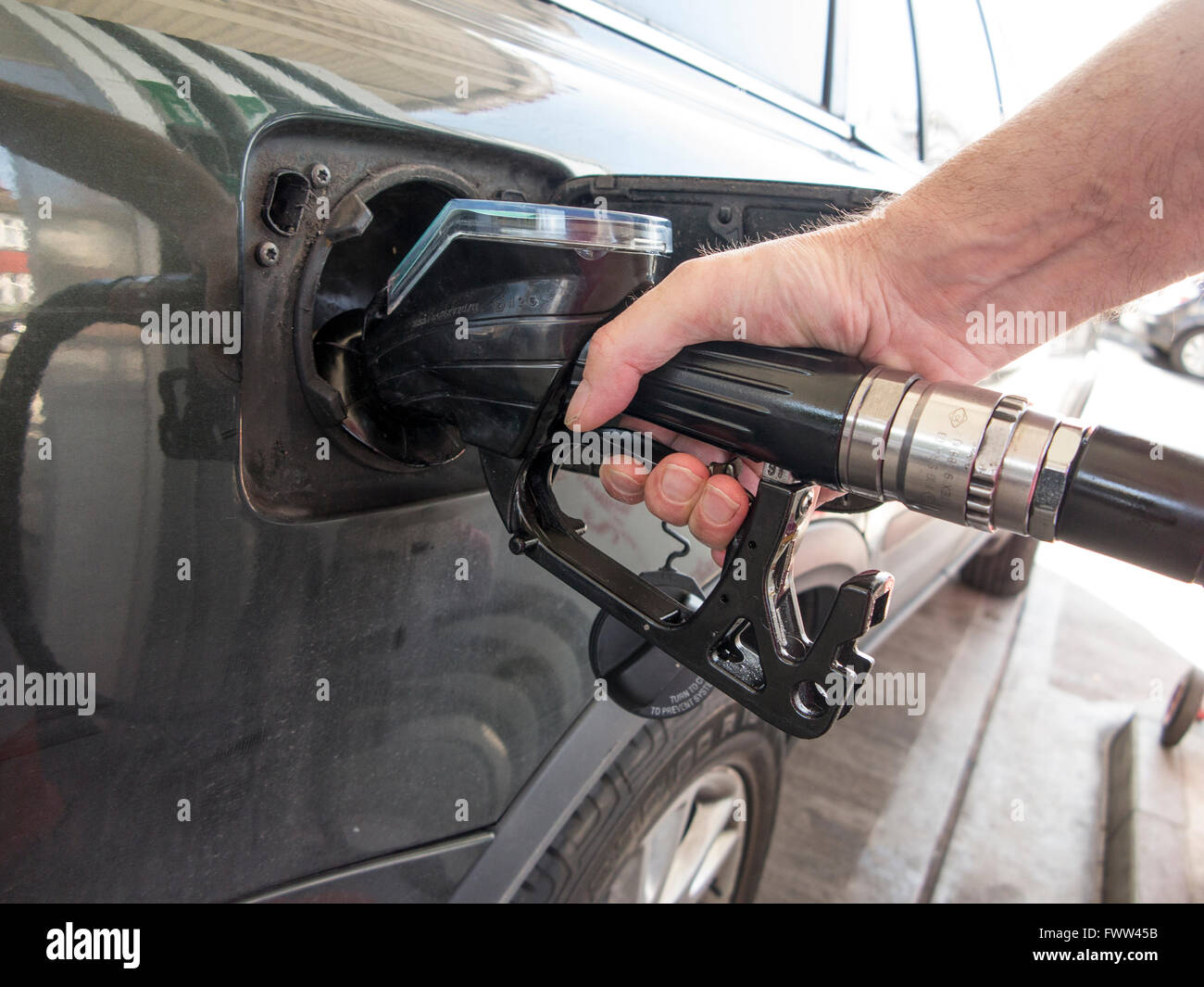 Filling a car with diesel petrol Stock Photo - Alamy