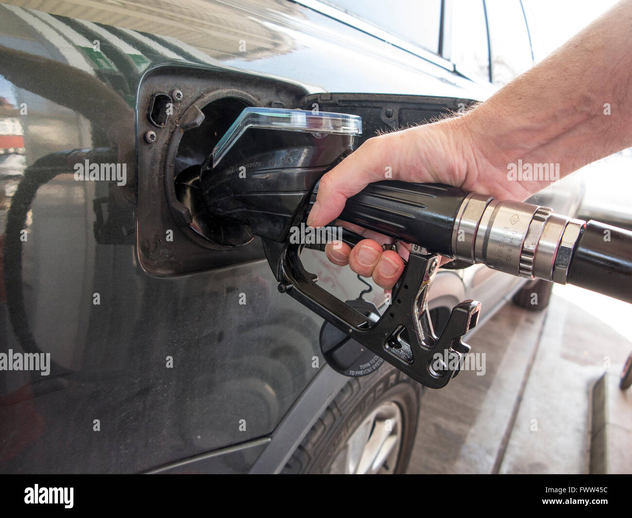 Filling a car with diesel petrol Stock Photo - Alamy