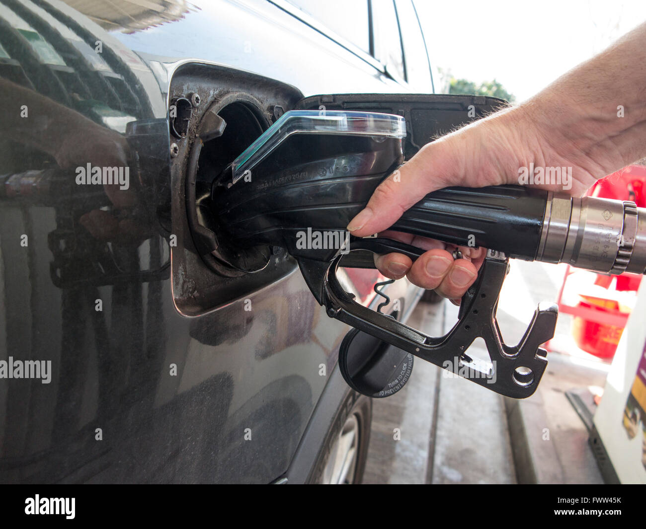 Filling a car with diesel petrol Stock Photo - Alamy
