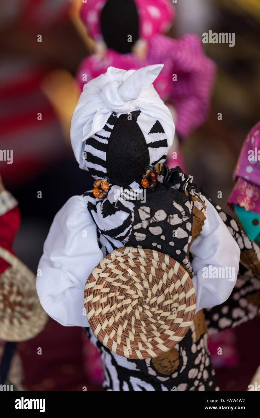 A Gullah Geechee doll holding a sweetgrass basket on display at the ...