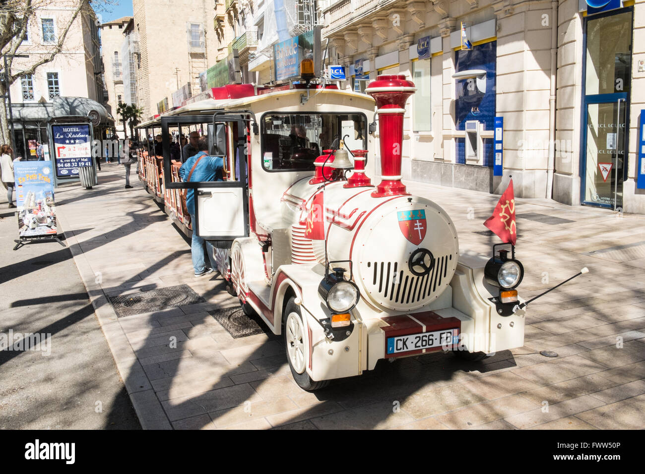 Micro train taking tourists for fee around centre of narbonne hi-res ...