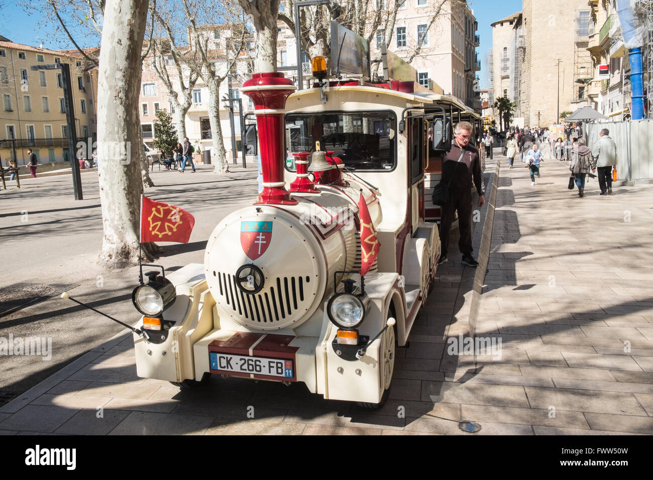 Micro train taking tourists for fee around centre of narbonne hi-res ...