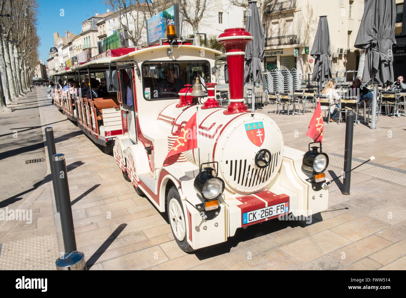 Micro train taking tourists for fee around centre of narbonne hi-res ...