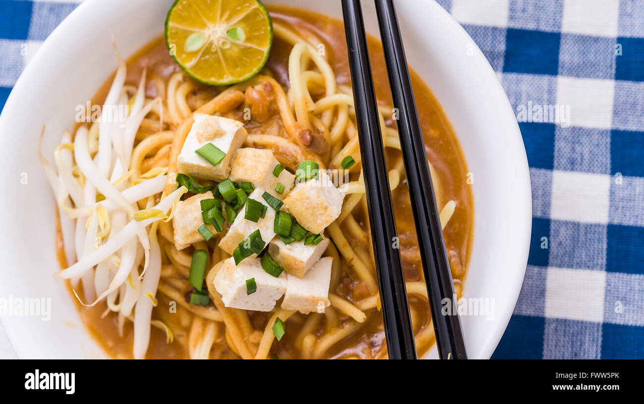 Delicious Malay cuisine mee goreng on white bowl Stock Photo - Alamy