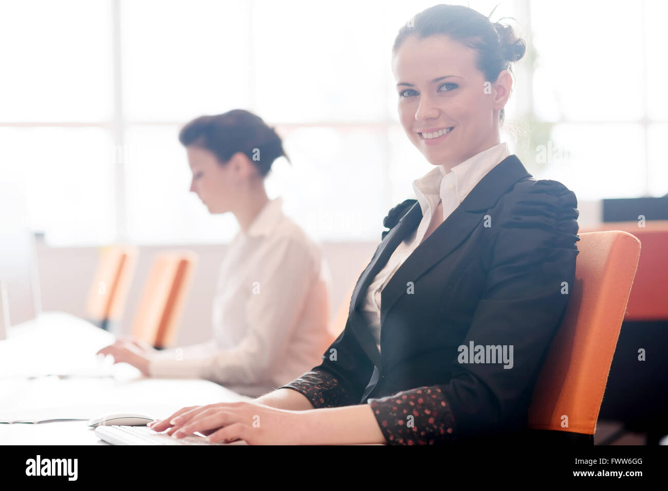 business woman working on desktop computer at modern startup office ...
