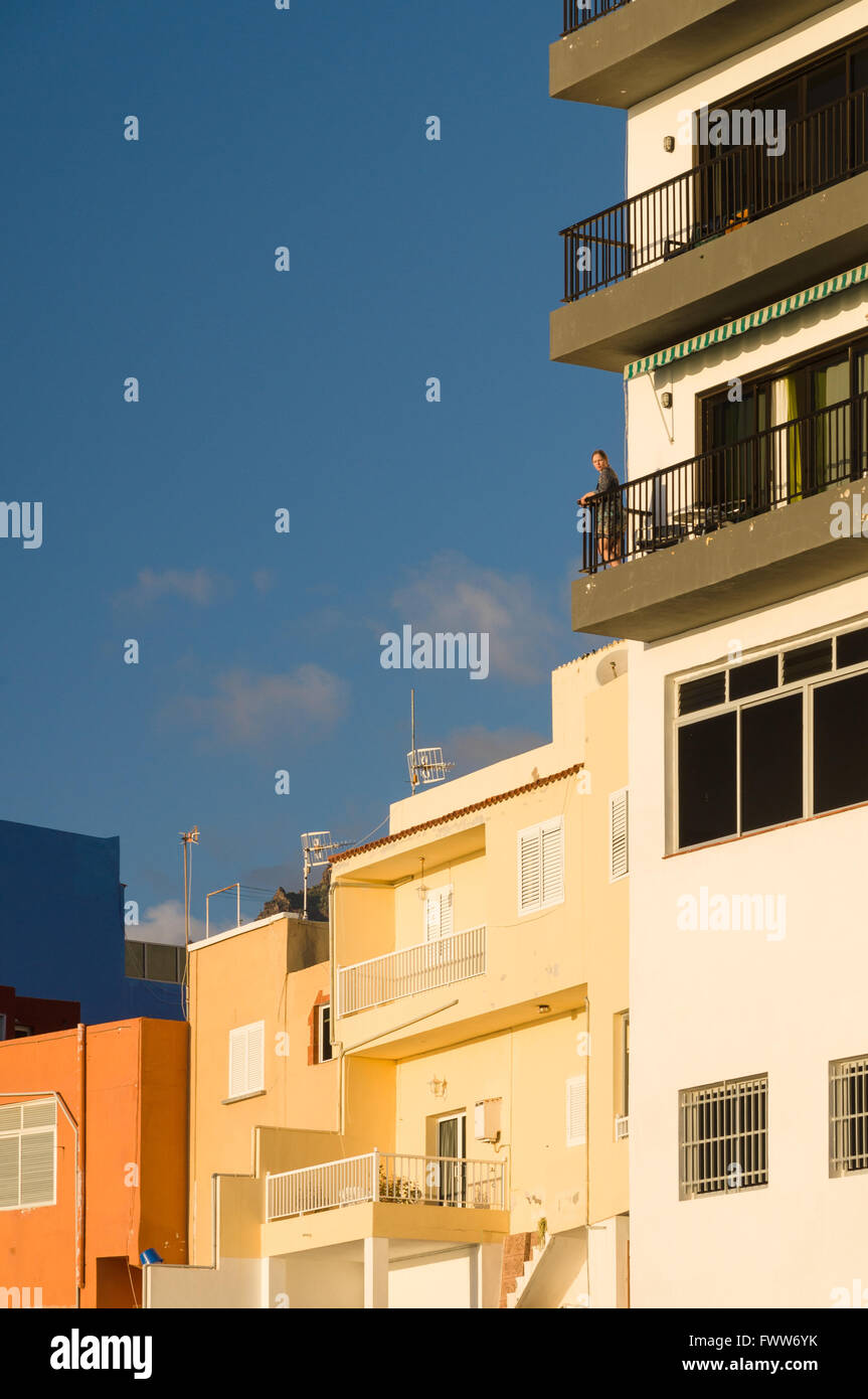 Young woman relaxing on terrace in evening sunlight Stock Photo - Alamy