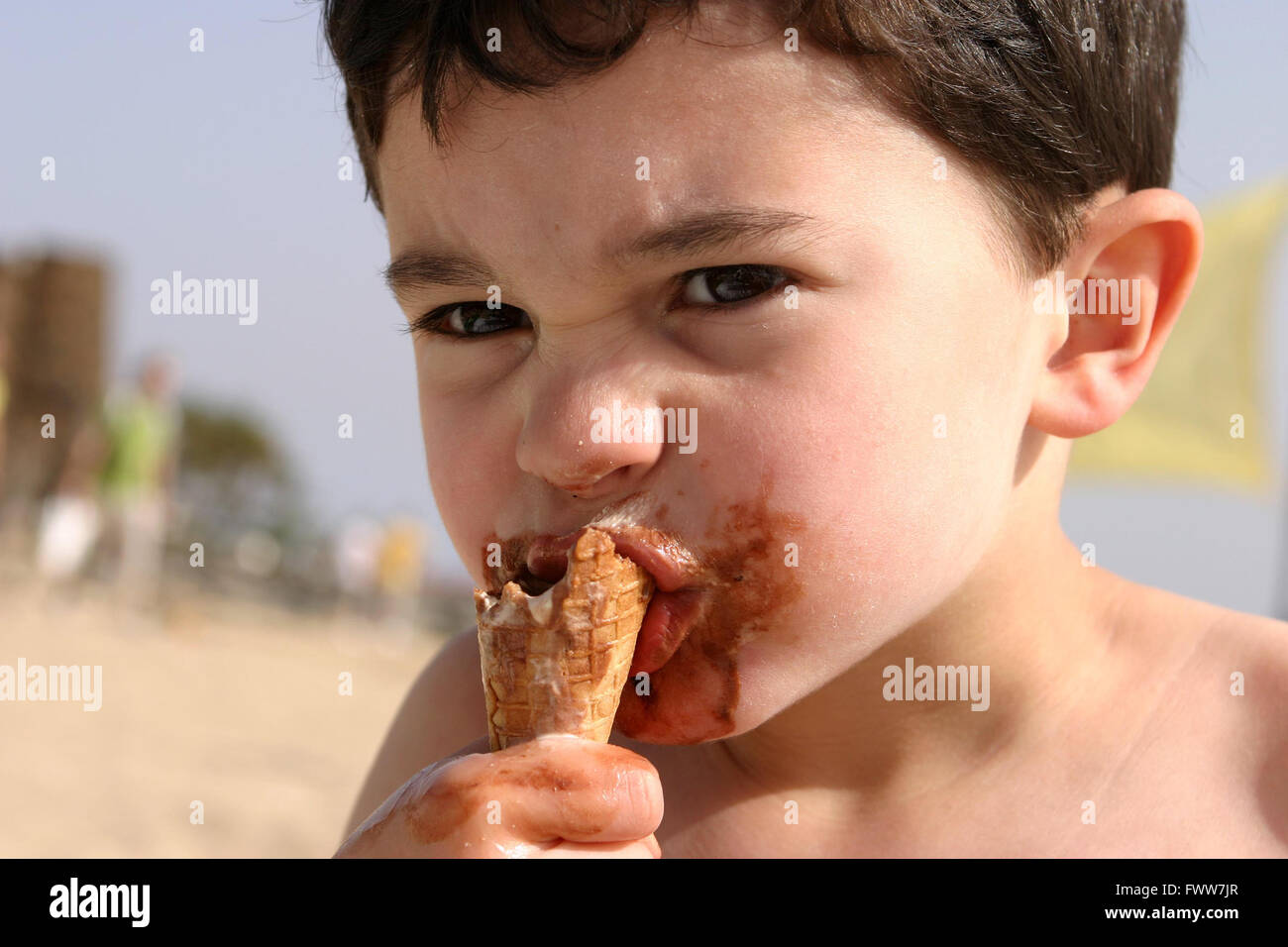 Boy playing on beach Stock Photo - Alamy