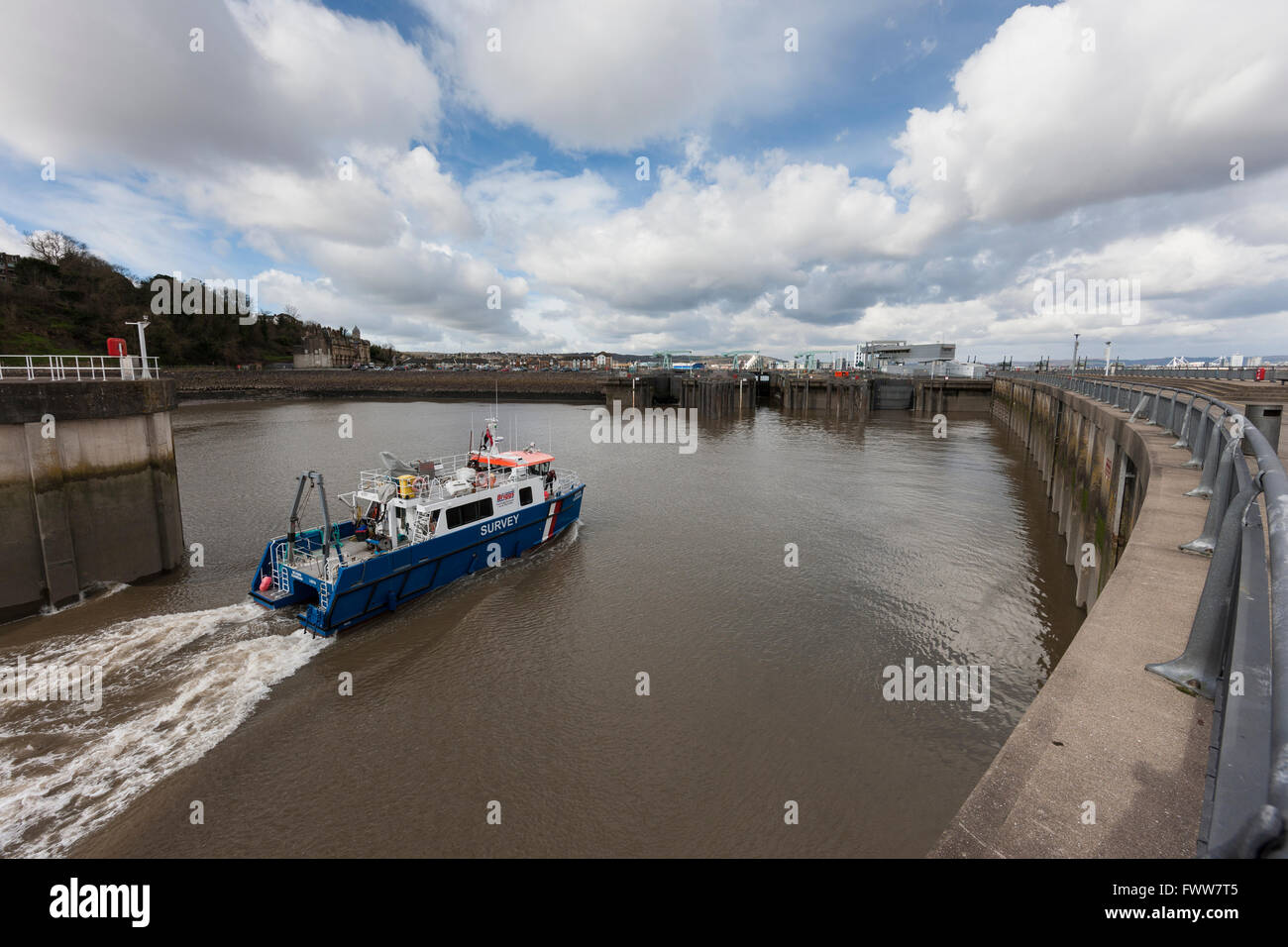 Survey vessel entering port. Penarth barrage and Cardiff Bay marina ...
