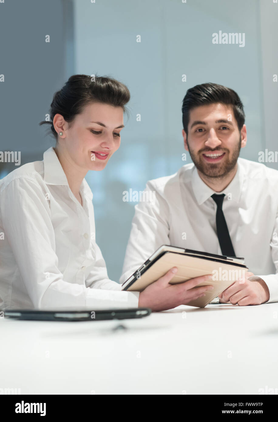 young business couple portrait at modern bright startup office meeting ...