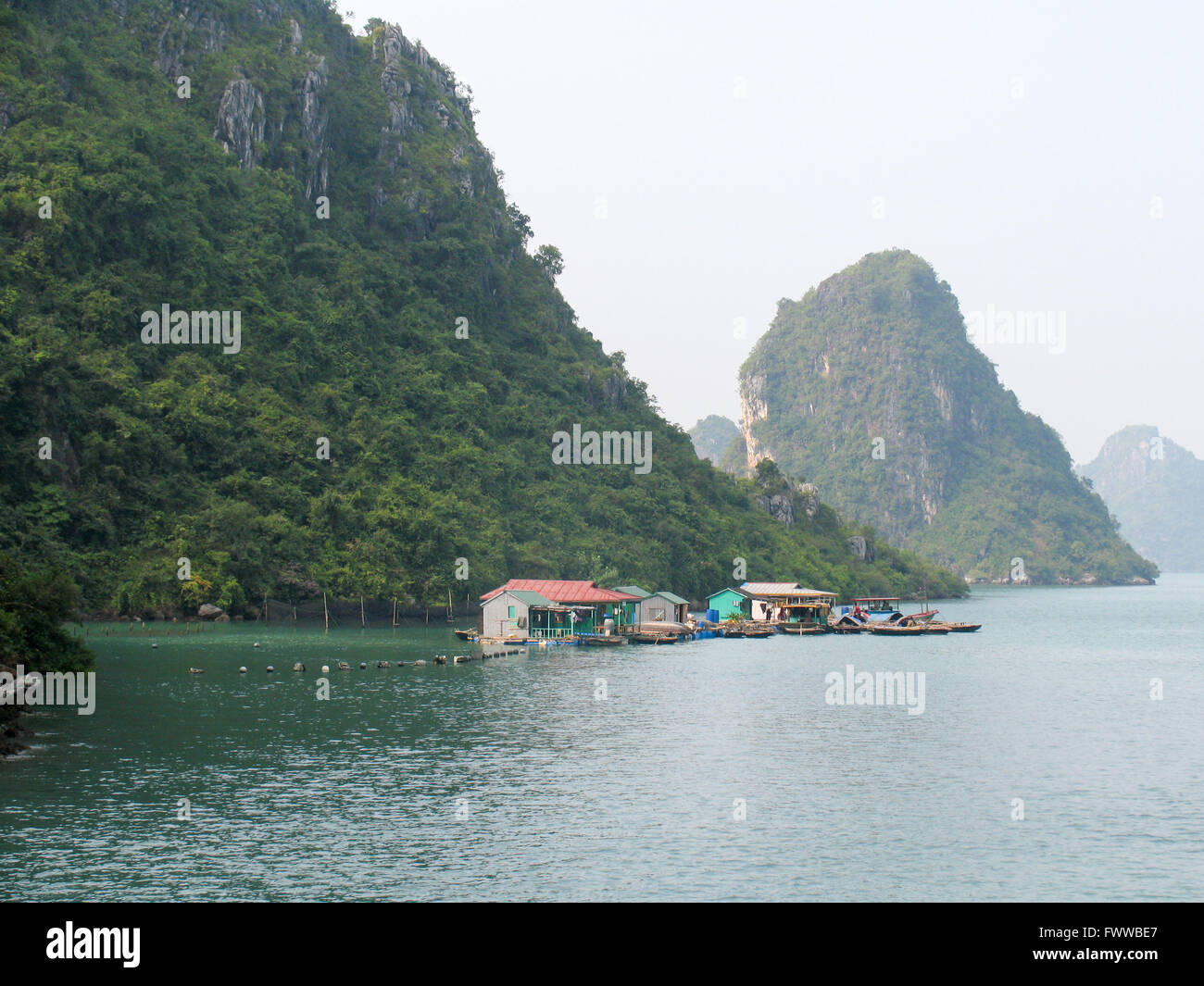A floating fishing village in Halong Bay, Vietnam Stock Photo - Alamy