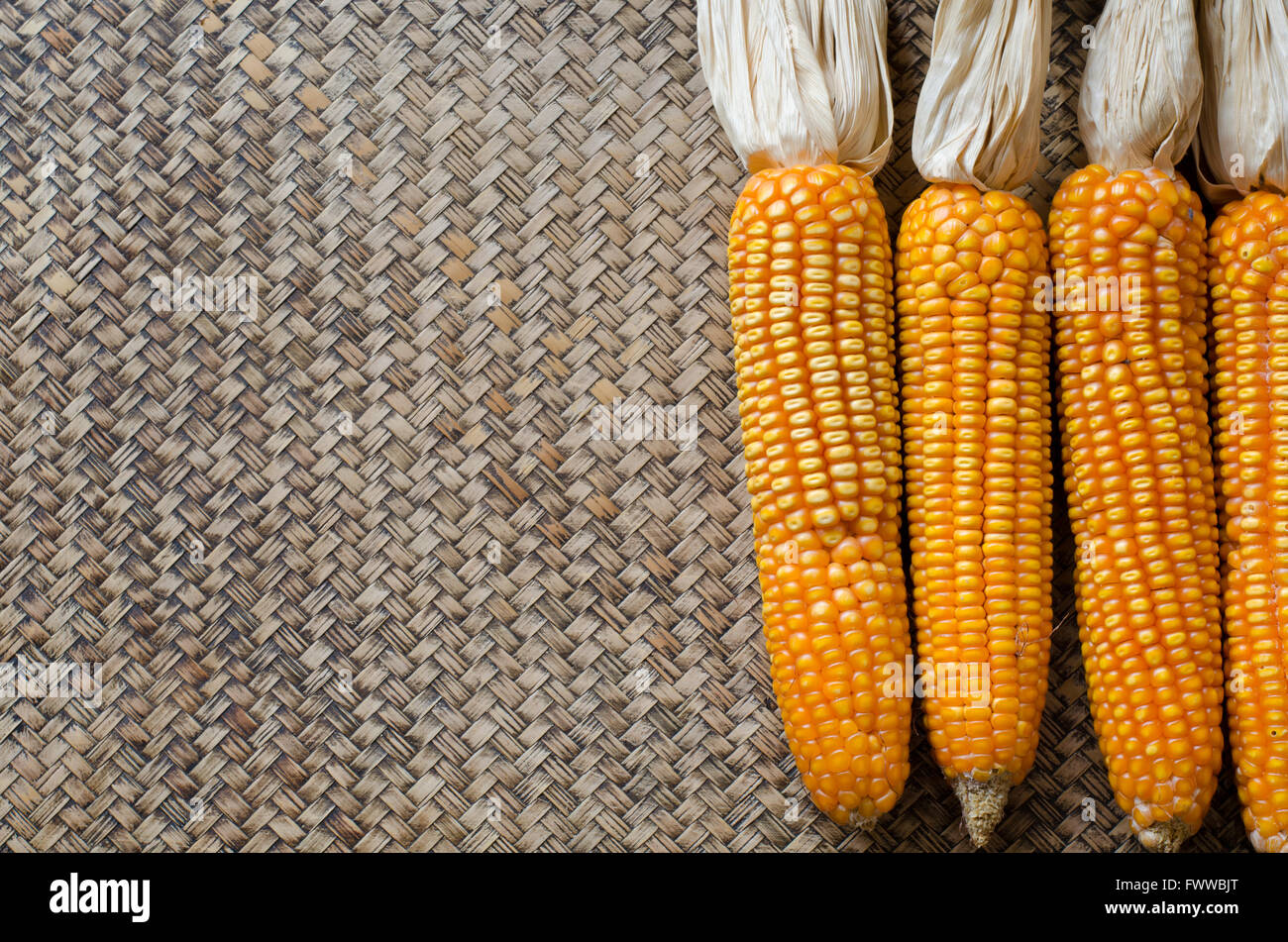 Corn dry on bamboo background Stock Photo - Alamy