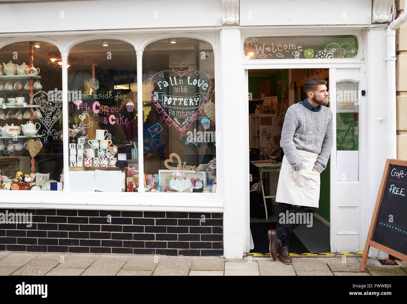 Male Owner Standing Outside Coffee Shop Stock Photo - Alamy