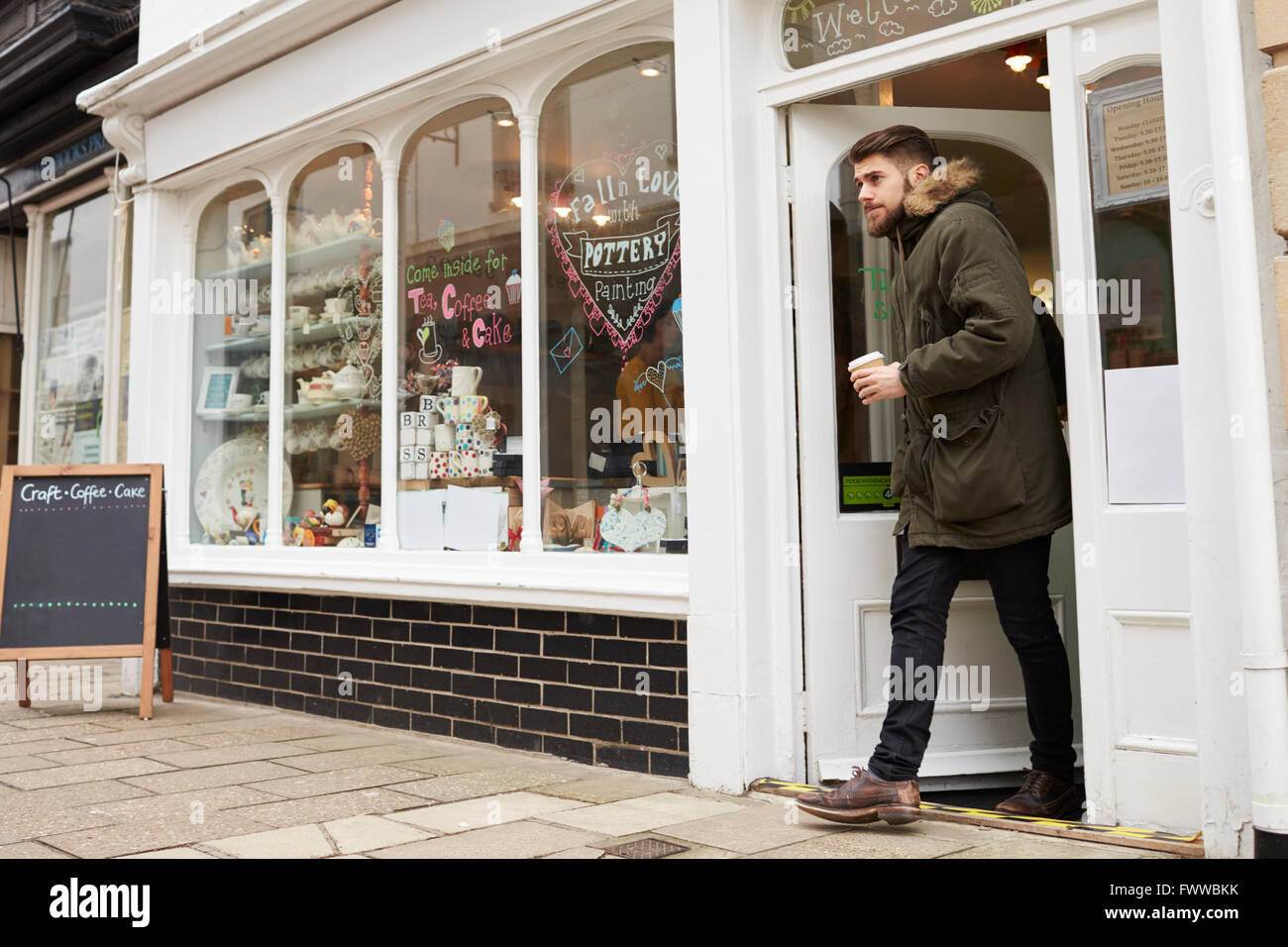 Man coming out of shop hi-res stock photography and images - Alamy