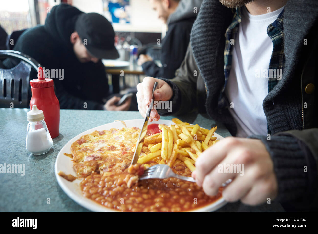 Happy student eating bar hi-res stock photography and images - Alamy