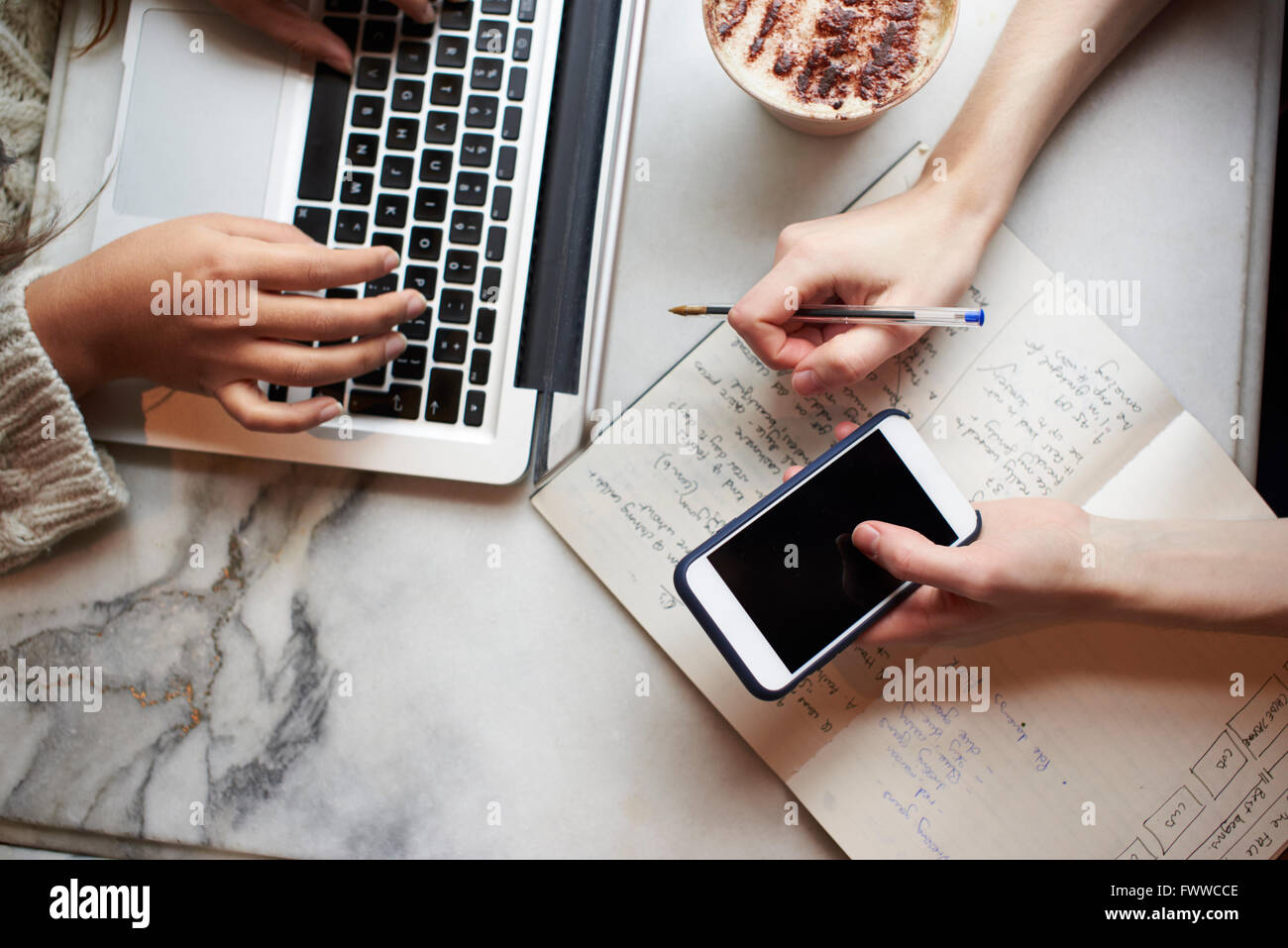Close Up Of Two People Working Remotely In Café Stock Photo - Alamy