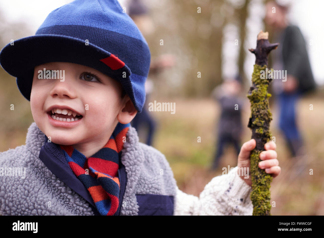 Young Boy Holding Stick On Family Winter Walk Stock Photo - Alamy Young Boy Holding Stick On Family Winter Walk Stock Photo - Alamy