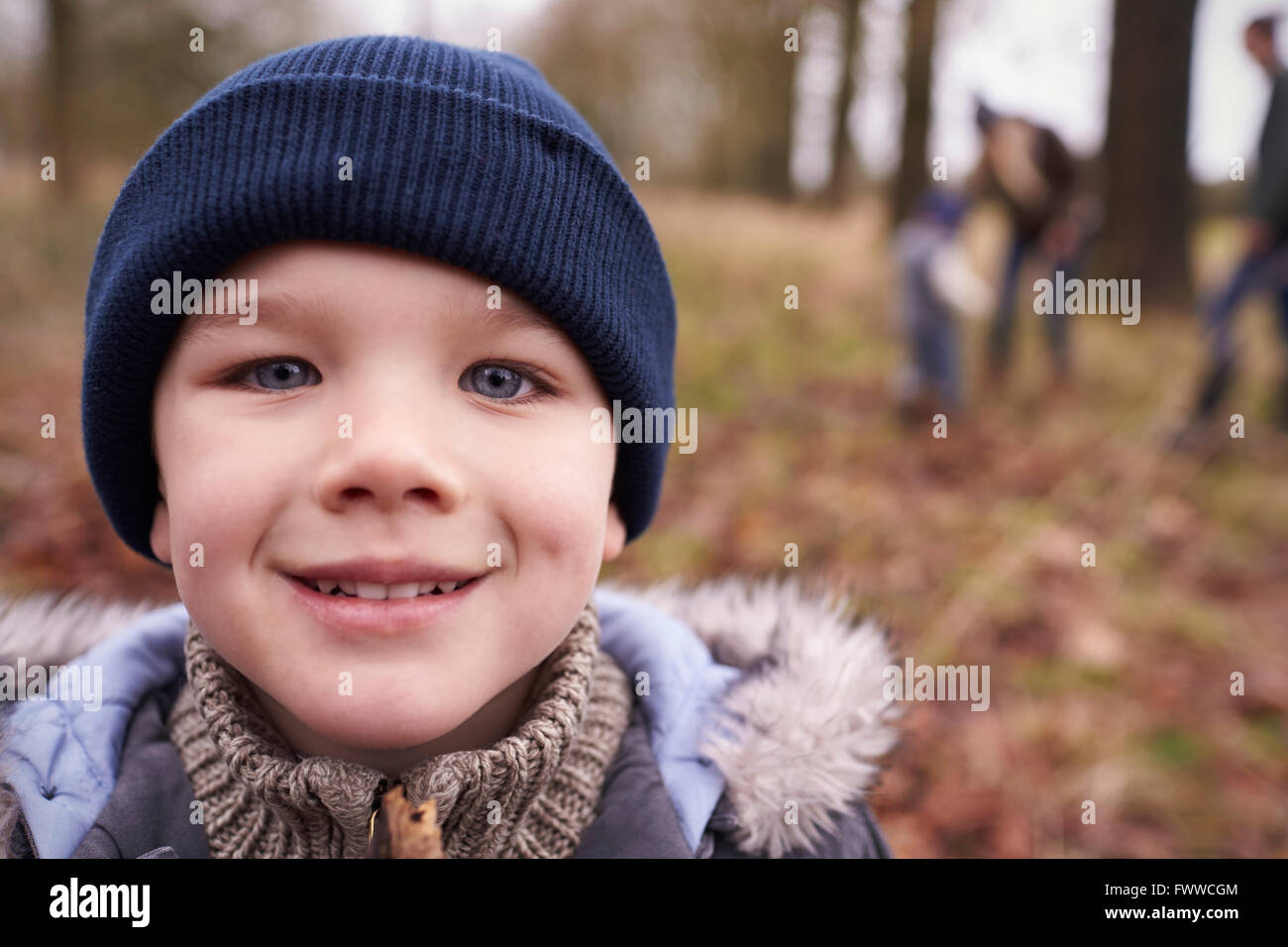 Portrait Of Young Boy On Family Winter Walk In Countryside Stock Photo ...