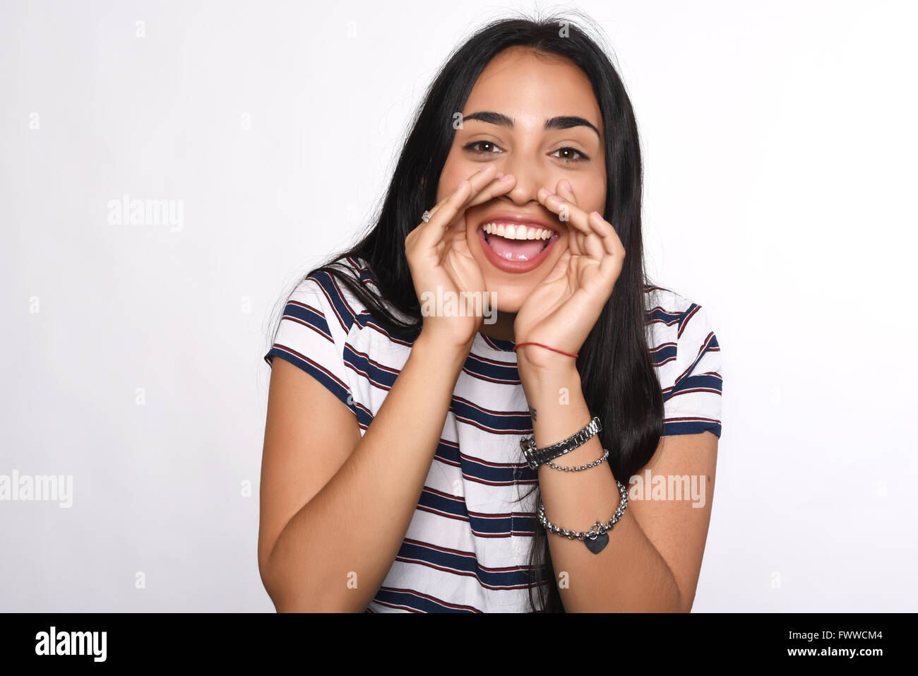 Beautiful young woman shouting and screaming. Isolated white background ...
