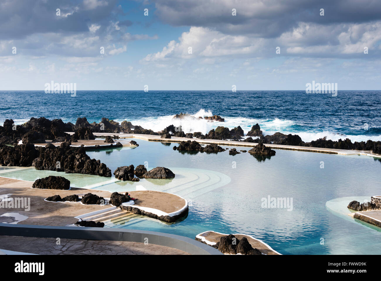 Natural pools in Porto Moniz with lava rocks and atlantic ocean as ...