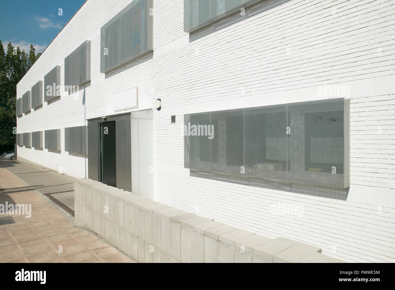 White building facade with metallic windows. Horizontal Stock Photo - Alamy