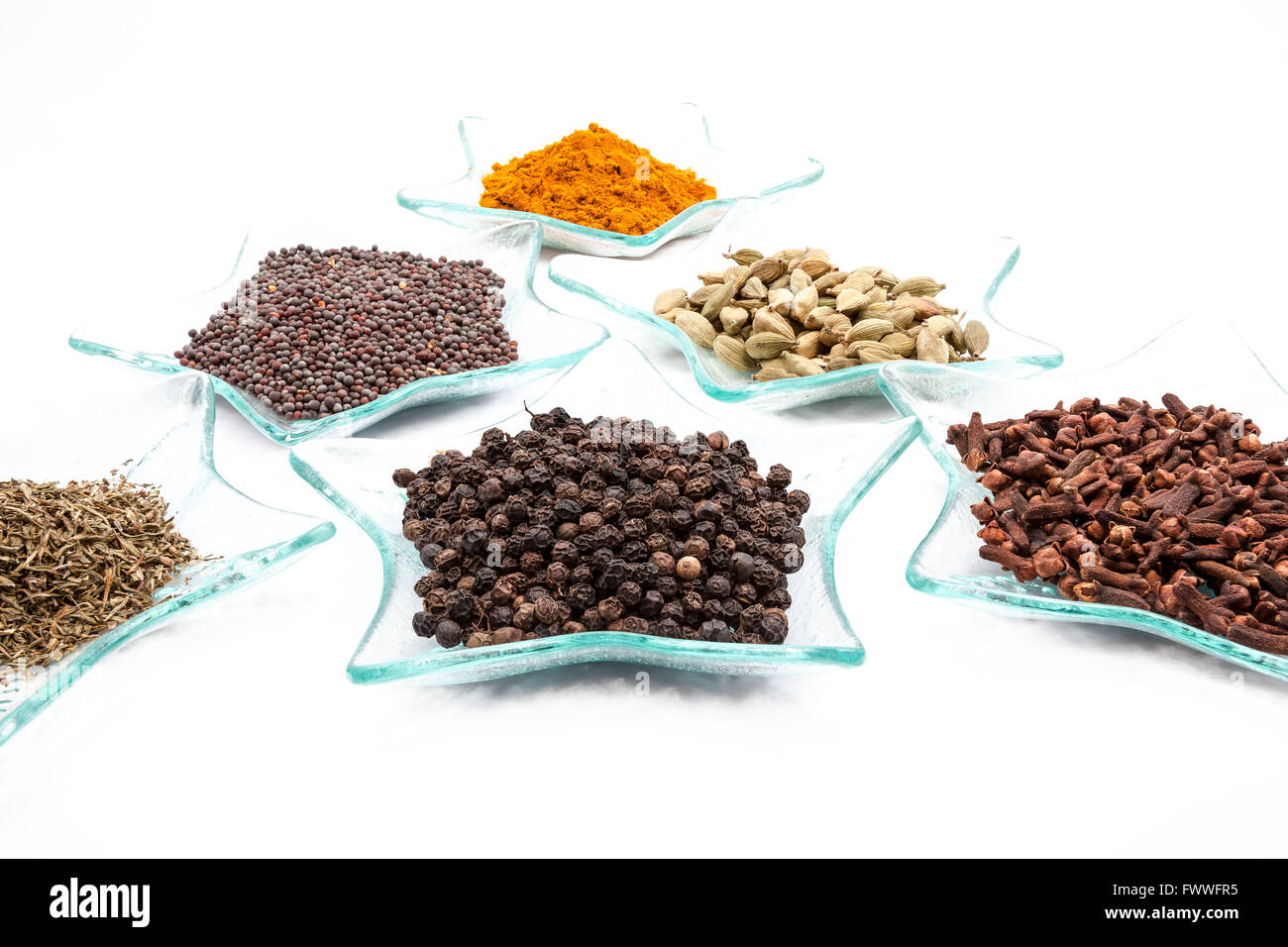 an star dishes of glass there are herbs or spices Stock Photo - Alamy