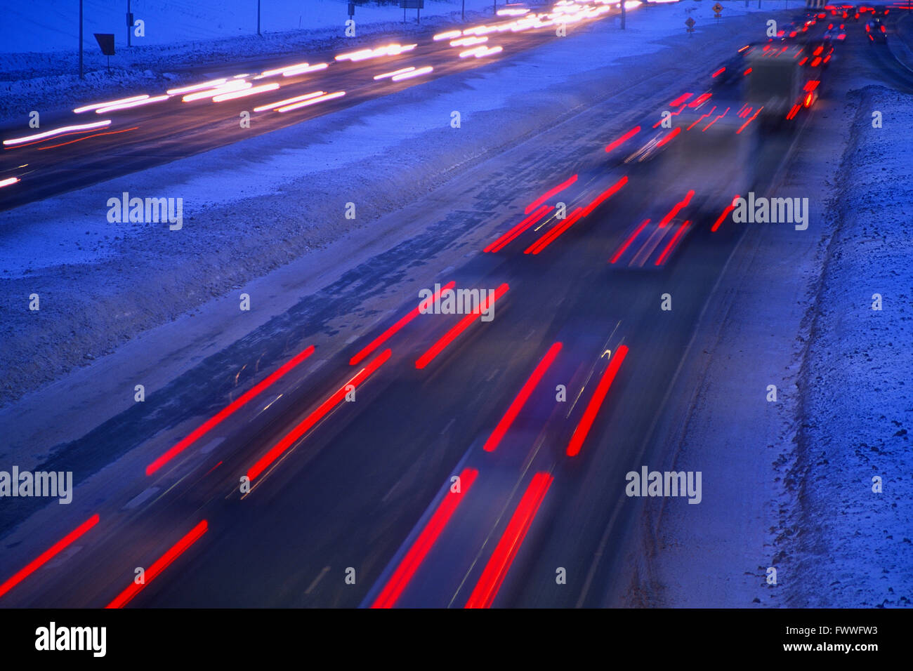 Freeway at Dusk with Streaking Car Tail Lights Stock Photo - Alamy