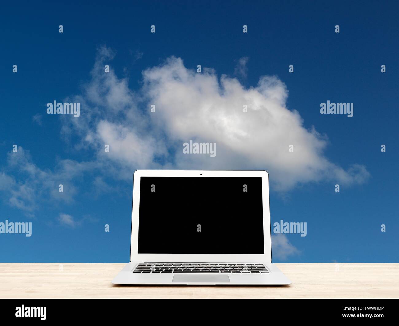 A morning shot of a cloudy blue sky with a laptop Stock Photo - Alamy
