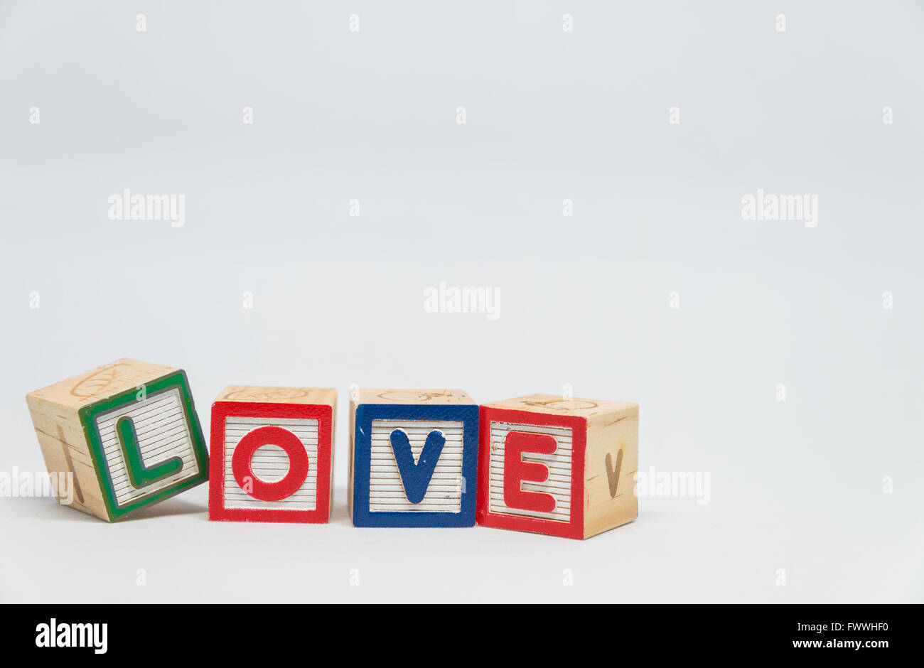 Wooden block LOVE word with white background Stock Photo - Alamy