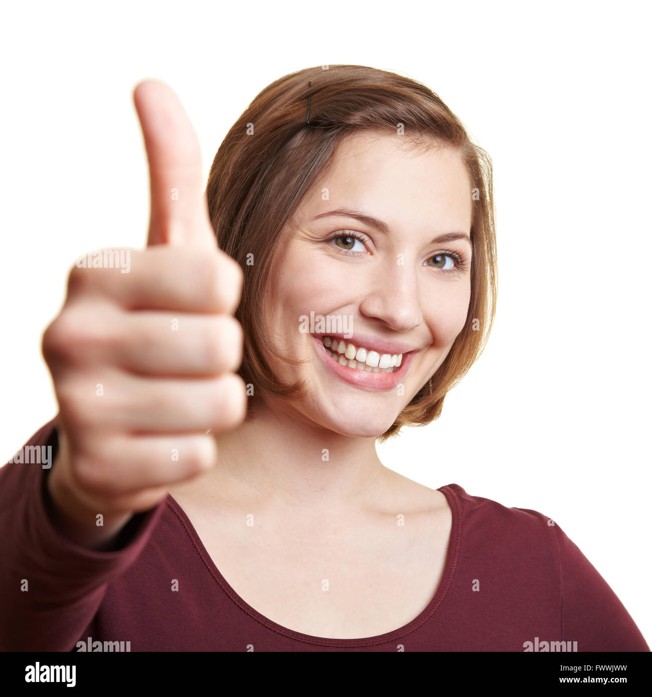 Charming smiling woman holding one thumb up Stock Photo - Alamy