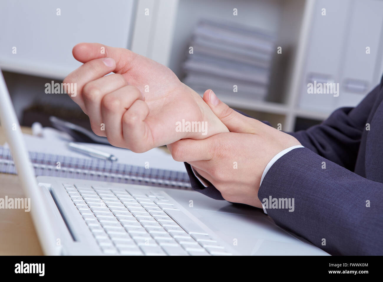 Hands with RSI syndrome over the keyboard of laptop computer Stock ...