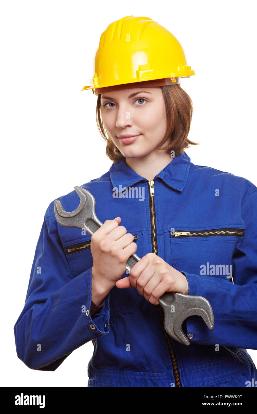 Female builder in overall with helmet and big wrench Stock Photo - Alamy