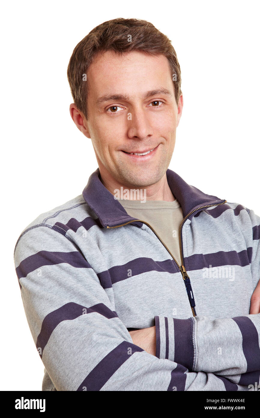 Happy smiling man crossing his arms Stock Photo - Alamy