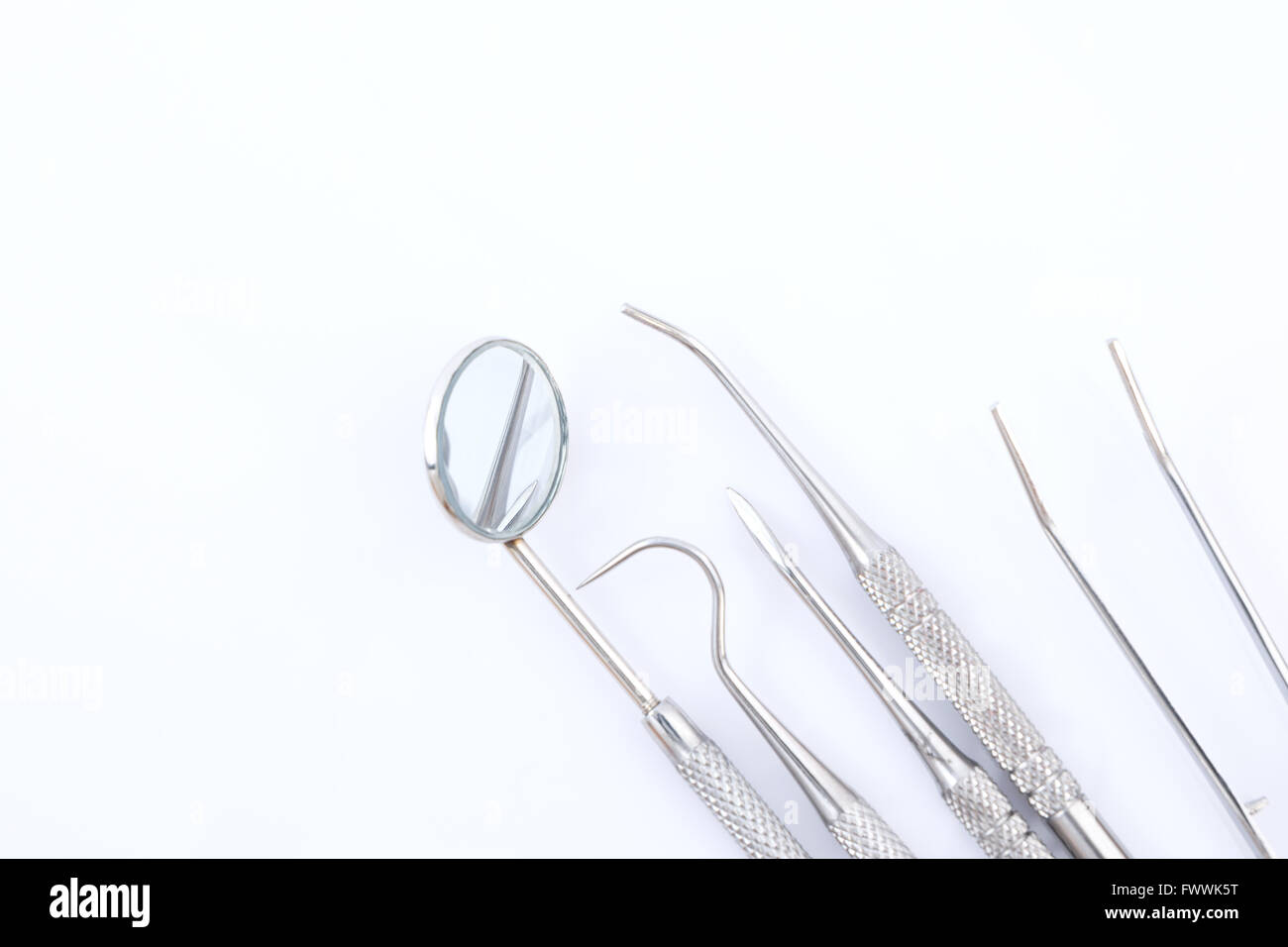 Dental tools on white background Stock Photo - Alamy