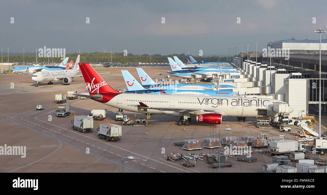 Line-up of aircrafts on arrival gates. Manchester Airport, Manchester ...