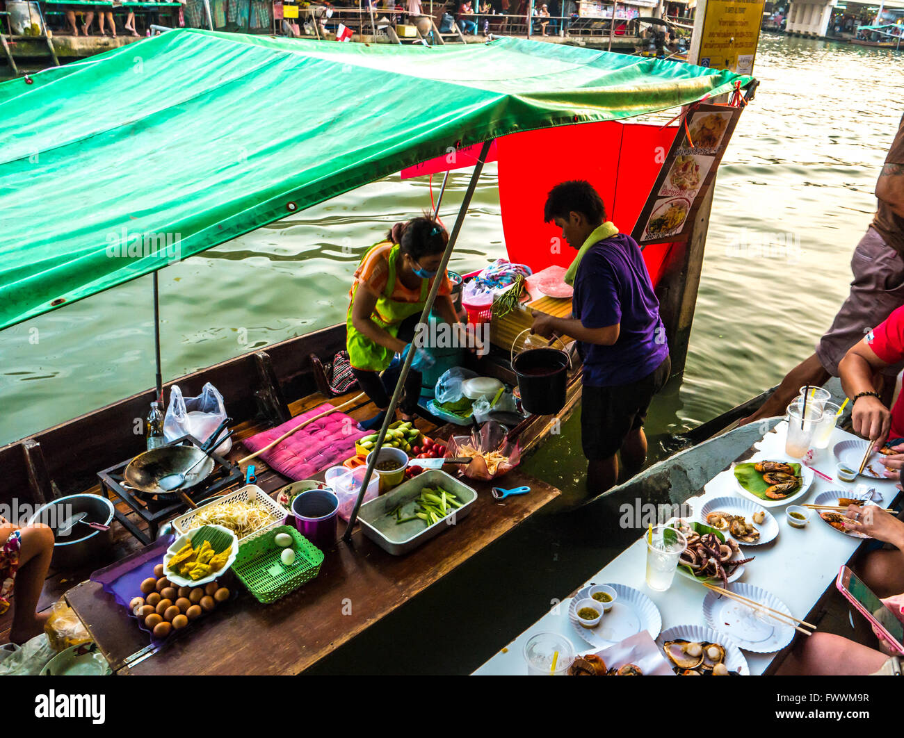 Trader's boats in a floating market in Thailand Stock Photo - Alamy