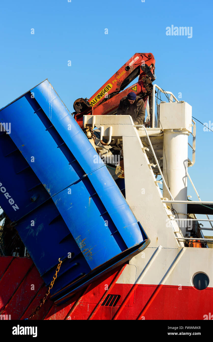 Simrishamn, Sweden - April 1, 2016: Male worker sit on top of a bridge ...