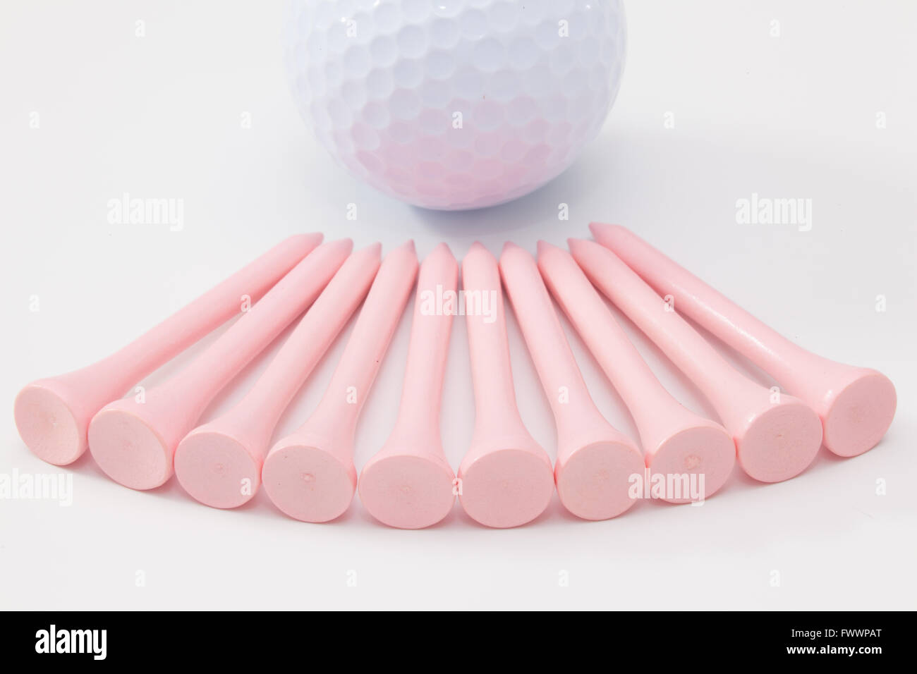Wooden golf tees on the white background Stock Photo - Alamy