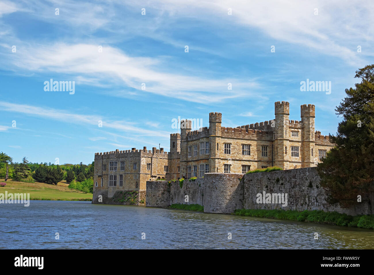 Leeds Castle in a lake in Kent in England. The castle was built in the ...