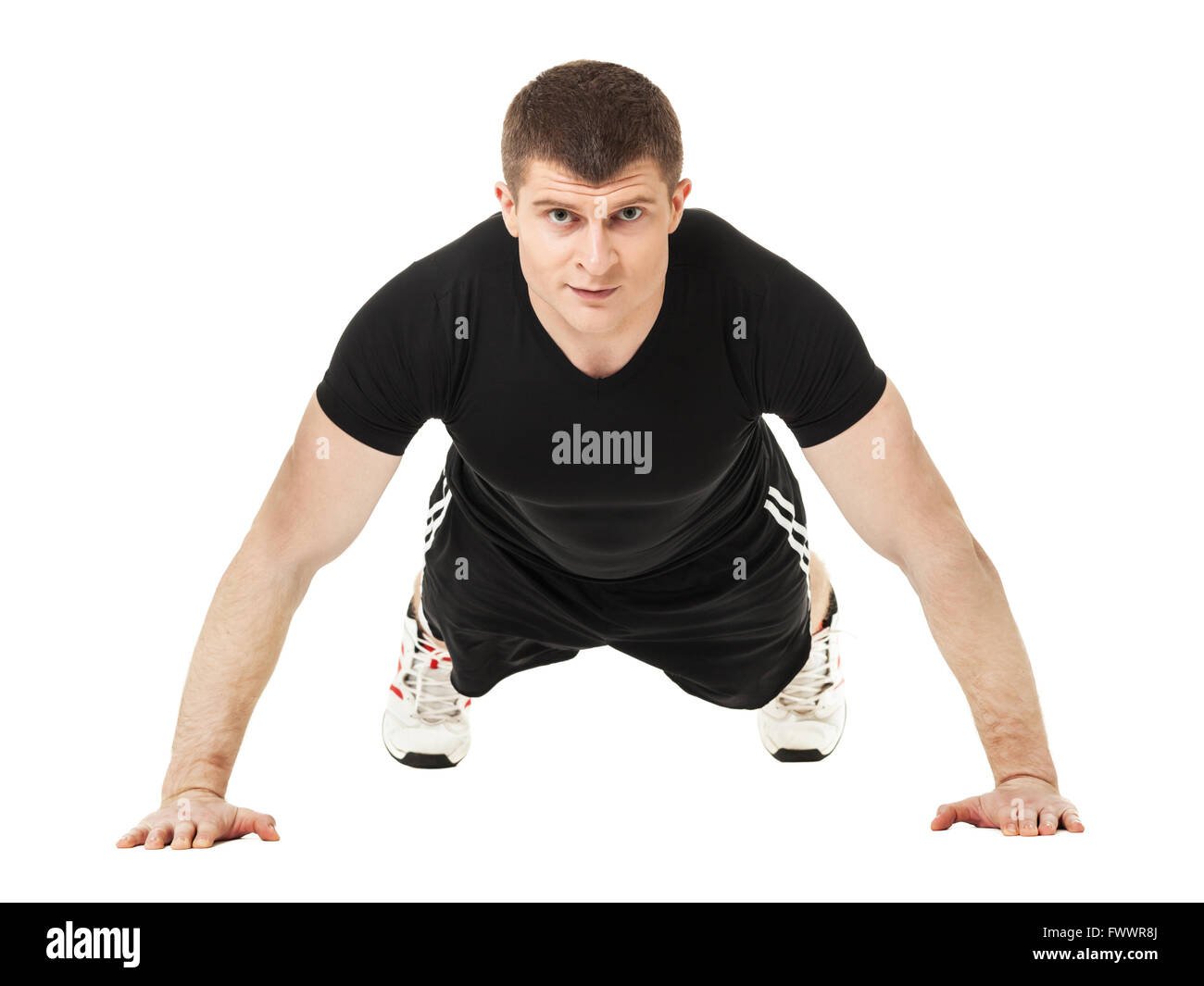 Young man doing push up exercise isolated on white background Stock ...