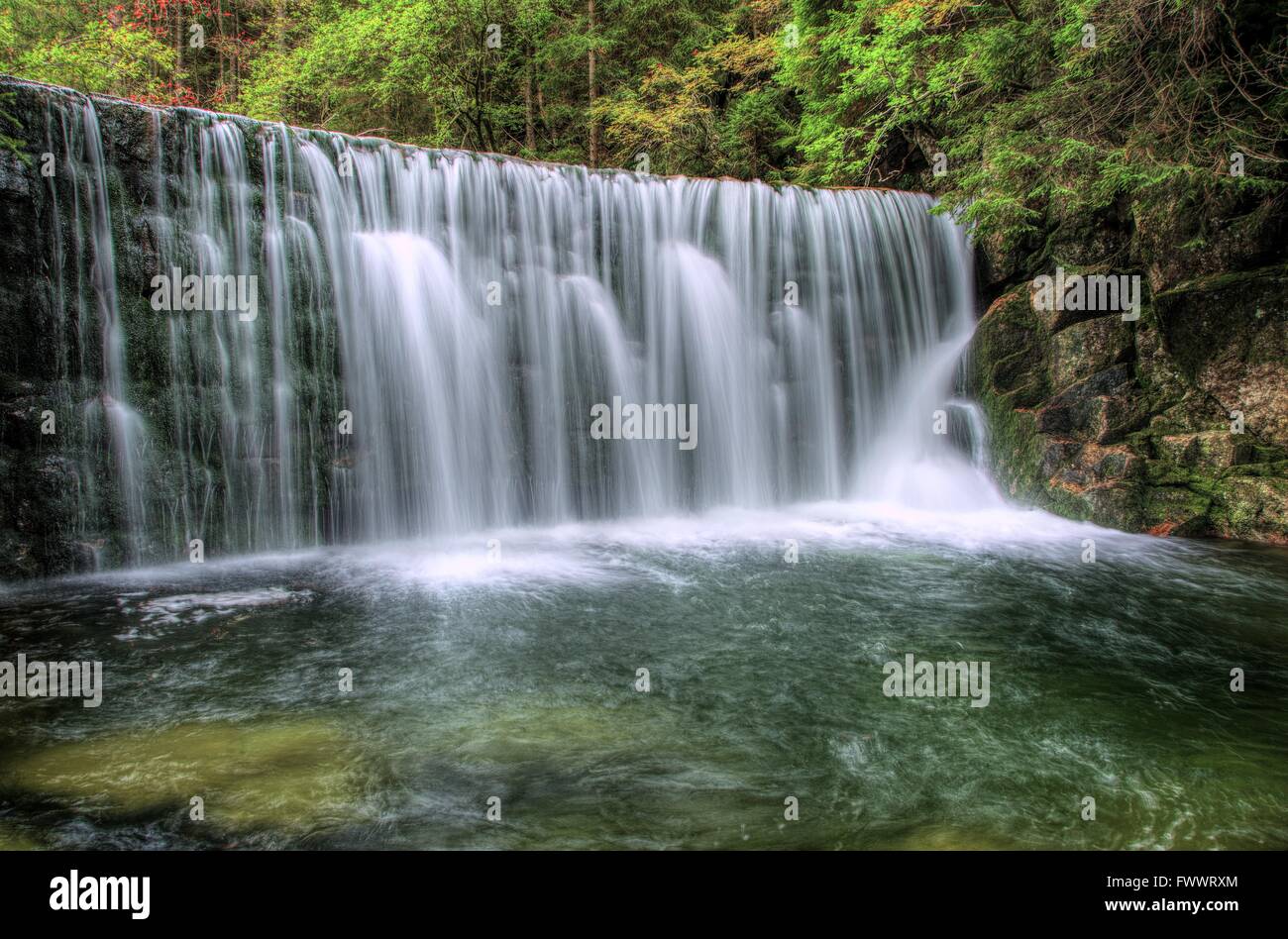 Awesome wide waterfall in summer / mossy rock and forest Stock Photo ...
