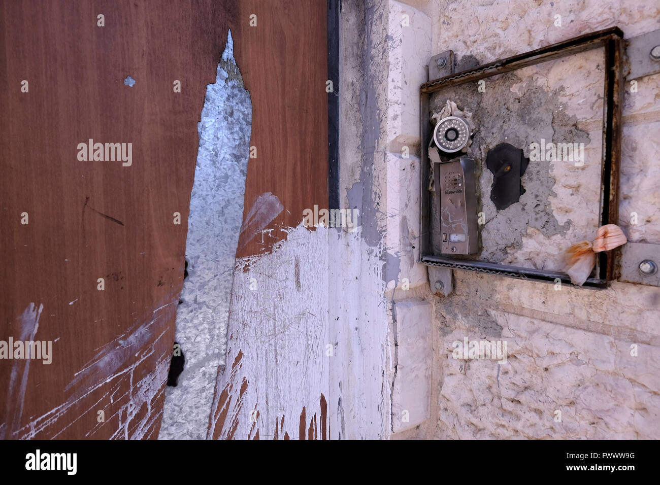 Spray paint and damage is seen in a door of a building which Jewish ...