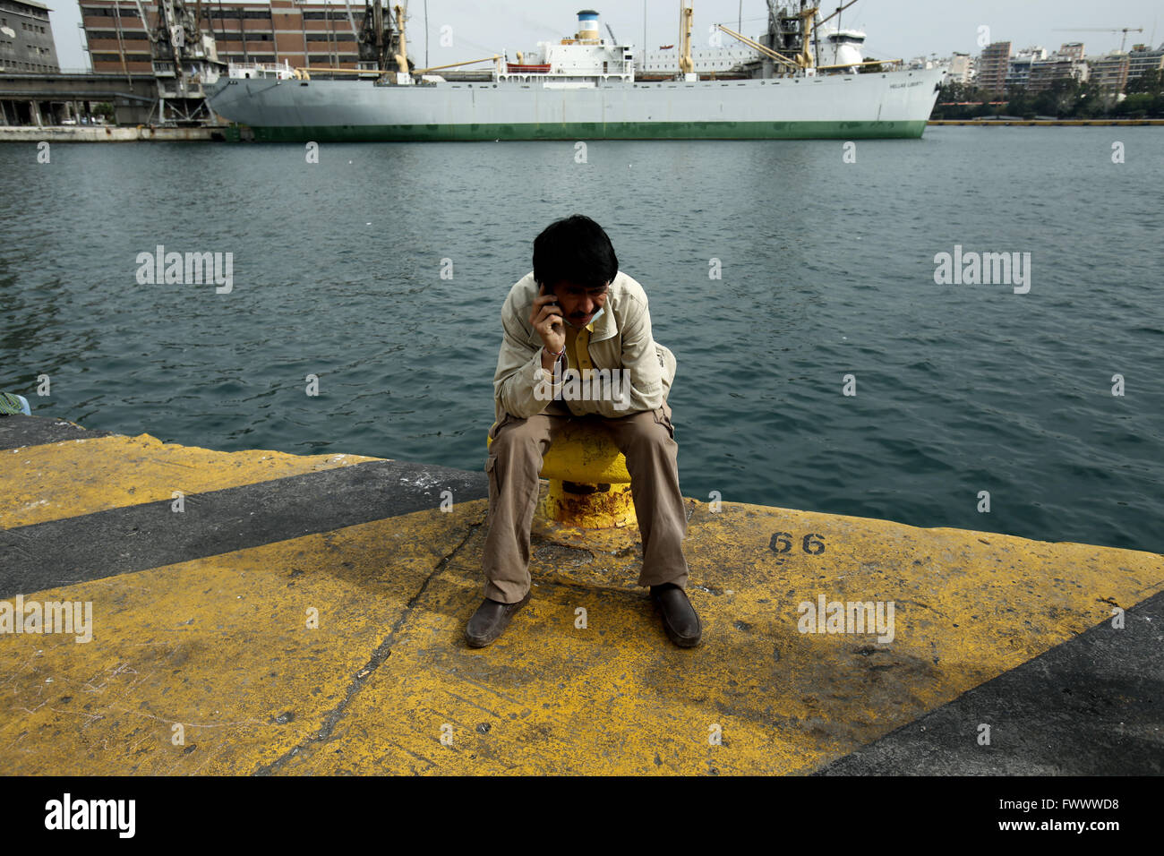 Piraeus, Greece. 07th Apr, 2016. A man at the dock of Piraeus port near ...
