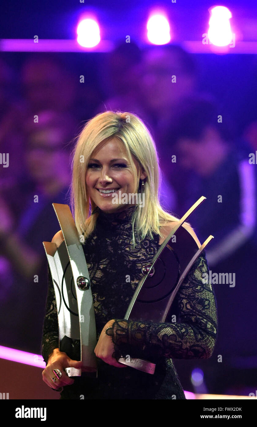 Berlin, Germany. 7th Apr, 2016. Singer Helene Fischer poses with her ...
