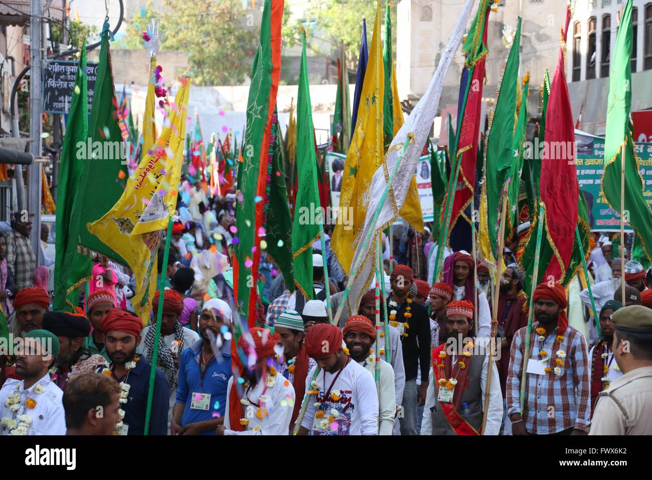 Ajmer, India. 08th Apr, 2016. Sufi Muslim pilgrims carry flags as they ...